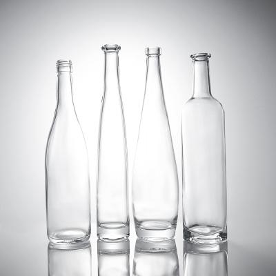 Cina Bottiglia di liquore di vetro con tappo di sughero Materiale del corpo Vetro di forma rotonda personalizzata in vendita
