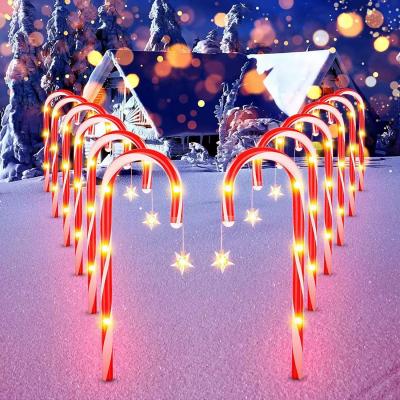China Solar-powered Christmas star snowflake pendant walking stick lamp holder Christmas scene candy walking stick lamp string light for sale