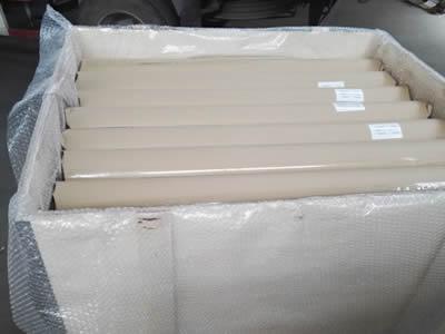 Many tungsten wire cloth rolls wrapped with moisture-proof paper put in a carton.