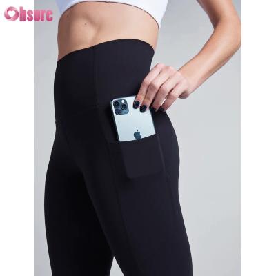 China Wholesale Factory Bottom Price Yoga Leggings for Women High Compression Quick Dry Polyester With Phone Pocket Workout Leggings for sale