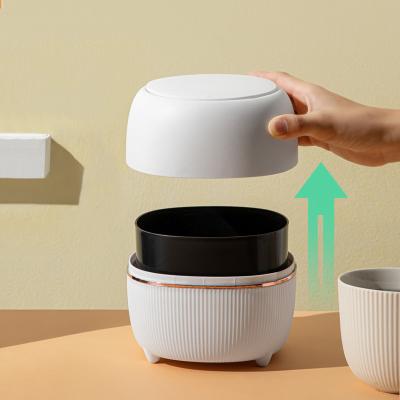 中国 Small Desktop Creative Mini Trash Can Candy Colored Desk Press Round Covered Wastebasket Storage Bin 販売のため