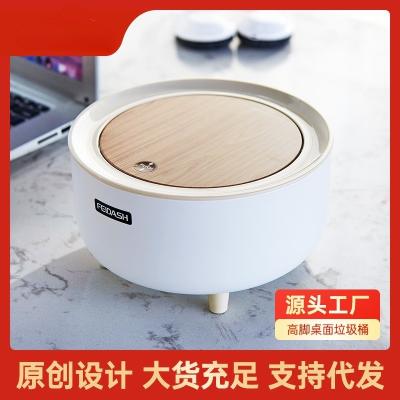 中国 Wood Grain Round Household Desktop Mini Simple Large-capacity Wastepaper Basket Plastic High-footed Trash Can 販売のため