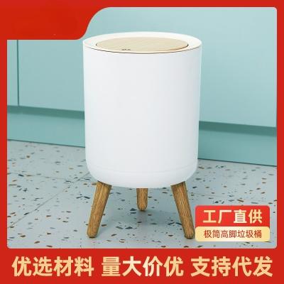 中国 Wood Grain Round Household Desktop Mini Simple Large-capacity Wastepaper Basket Plastic High-footed Trash Can 販売のため