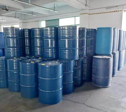Triethylamine product photo showing industrial packaging and liquid appearance