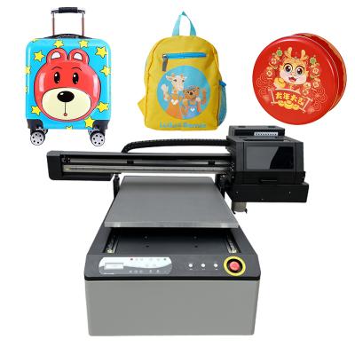 China Vacuum Adsorption Table Varnish 6090 UV Flatbed Inkjet Printer for Glass airpods Package Bags Acrylic Wood for sale