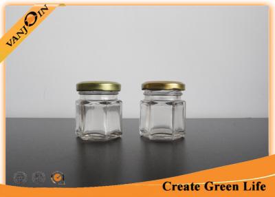 Cina contenitori di stoccaggio di vetro dell'alimento di esagono 1.5oz con il coperchio del metallo dell'oro, barattolo di vetro sigillabile in vendita