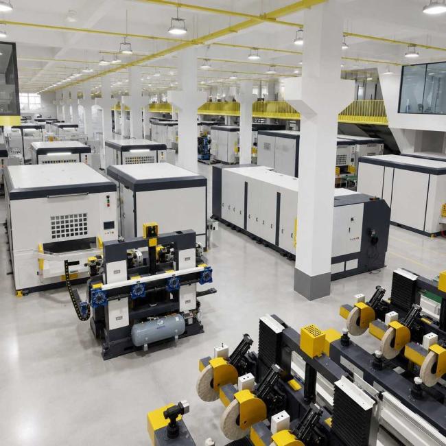 Robotic polishing machine in operation showing precision grinding of brass components