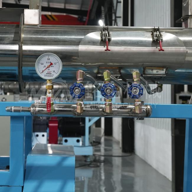 Precision gas distribution valve for regulating steam flow and temperature during aquafeed puffing.