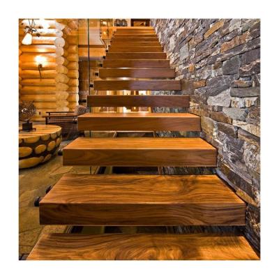 Cina Rubber wood floating staircase steel wood chimney cable railing floating stairs in vendita
