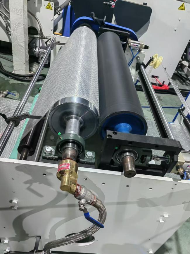 Close-up detail of the online recycling and rewinder unit