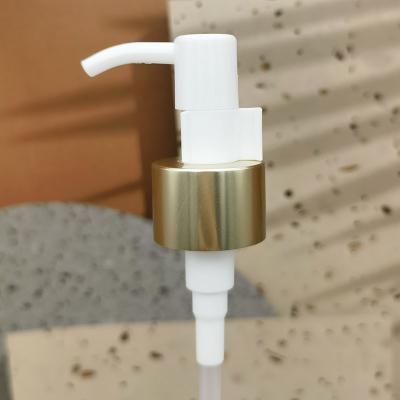 Cina 24/410 Long Nozzle Plastic Cosmetic Lotion Pump Gold Aluminum Closure Metal Shell With Clip in vendita