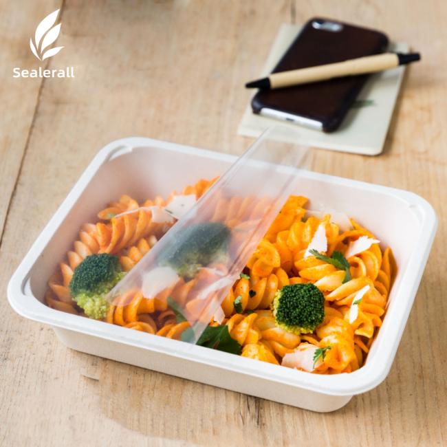 Biodegradable tray sealer machine in operation