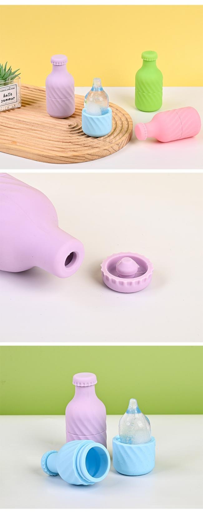 Green silicone ice roller in use on facial skin