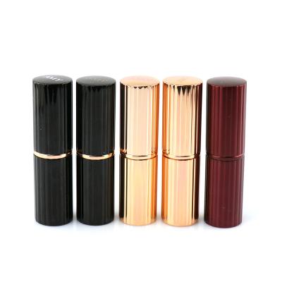 中国 OEMのABS円形の金のワイン レッドの黒い空の口紅の管20g 販売のため