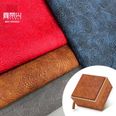 China PVC Printed Dragon Pattern Embossed Synthetic Leather Durable Faux Leather Fabric for Notebook Table Mat Phone Upholstery Lining for sale