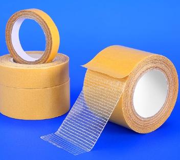 Double-sided cloth tape product display showing adhesive properties