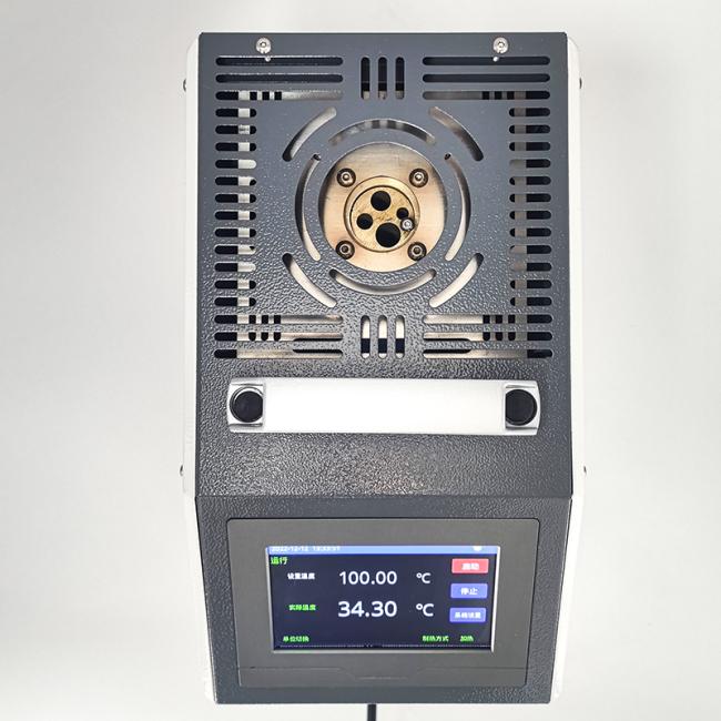 Dry Well Temperature Calibrator side view showing insertion wells and portability features