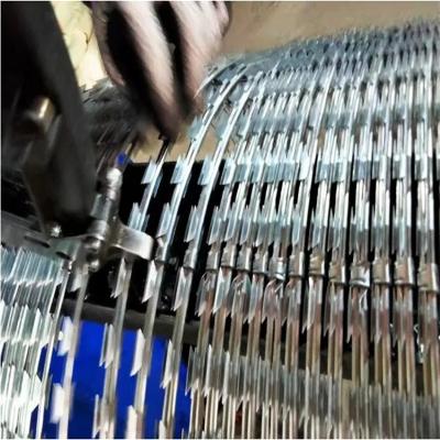 China Galvanized BTO22 Single Loop Cross Concertina Blade Barbed Razor Barded Wire Mesh Fencing for sale
