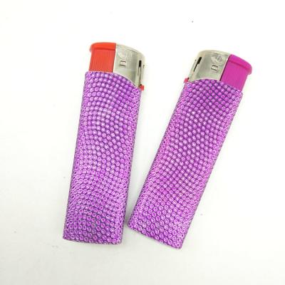 China Factory Wholesale Europe Child Resistance Refillable Diamond Surface Electronic Lighter for sale