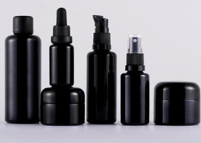 China Envases para el cuidado de la piel Negro Botella de crema de vidrio Envases para el cuidado de la piel Cosméticos Frasco de vidrio y botella de loción en venta