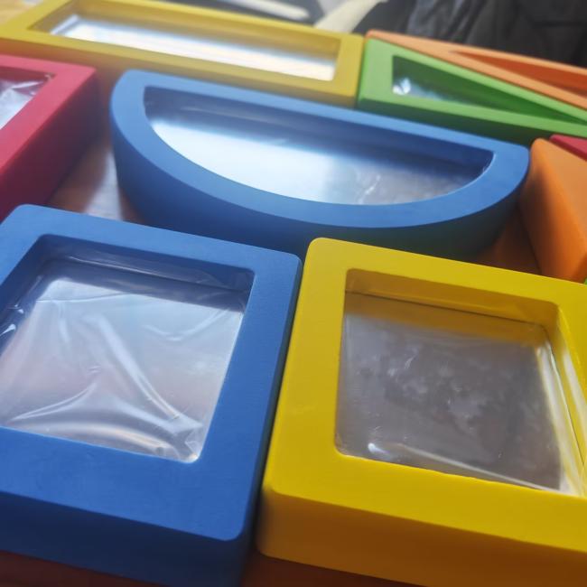 Children playing with sensory mirror blocks