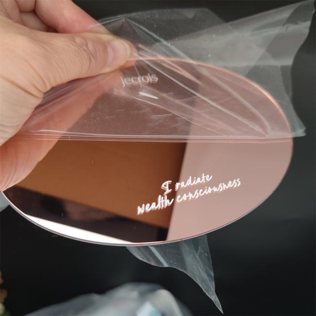 Close-up view of personalized engraved mirror surface