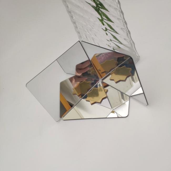 Close-up view of modular mirror tiles with clear reflection