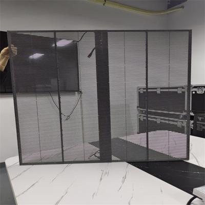 China Impresora de pantalla de vídeo a todo color exterior de rejilla LED transparente P2.6-6.25 impermeable en venta