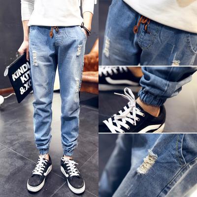 Cina I jeans affusolati due degli uomini della cinghia delle donne elastiche blu-chiaro del tessuto - usura laterale in vendita
