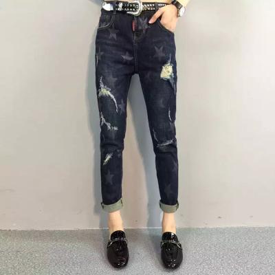 Cina Le donne di stile casuale hanno stampato i jeans scarni strappati motivo a stelle con la tasca ricamata in vendita
