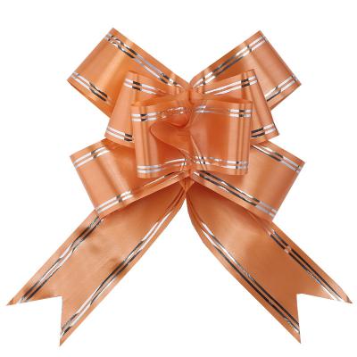 Cina Le linee d'argento farfalla degli archi di tirata del nastro di 4inches pp sono aumentato arco di tirata dell'oro in vendita