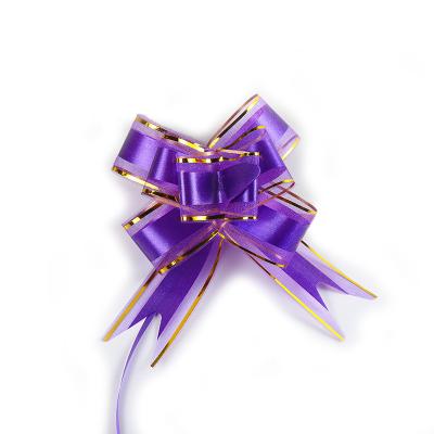Cina la tirata di plastica del nastro dell'involucro di regalo 6inches piega l'arco di tirata della farfalla per la decorazione del regalo in vendita