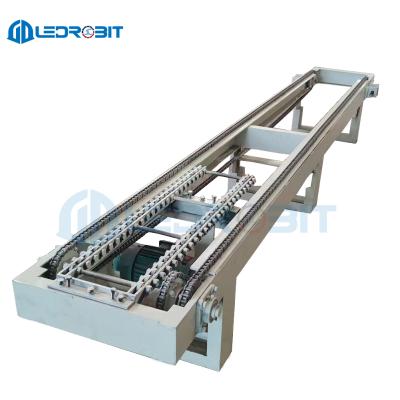 China Máquina de transporte de cadenas de carga pesada. Sistema de transporte de ladrillos y losas motorizado de grado industrial. en venta