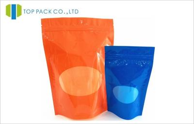 Cina L'alimento arancio solido della stampa sta sul sacchetto che imballa la finestra ovale in vendita