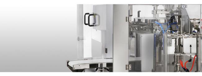 Close-up of rotary vacuum packaging machine components