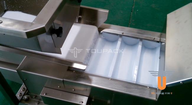 Close-up view of pouch filling mechanism