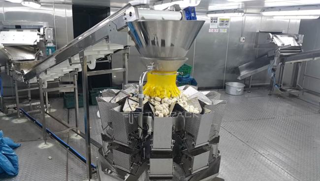 Close-up view of automated packaging system components