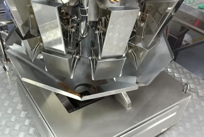 Close-up of weighing hoppers on packing machine