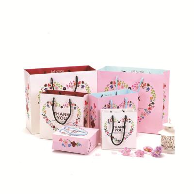 China Coated Printed Paper Bags / Shopping Black Pink Paper Bags With Handles for sale