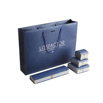 China Luxury Kraft Custom Printed Paper Gift Bags Embossing or Glossy Lamination for sale