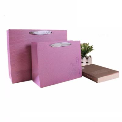 China Eco Friendly Kraft Gift Printed Paper Bags with Handle Luxury Shopping for sale