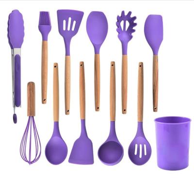 Cina silicone 12-Piece che cucina l'utensile della cucina messo con il silicone Supporto-di legno della maniglia in vendita
