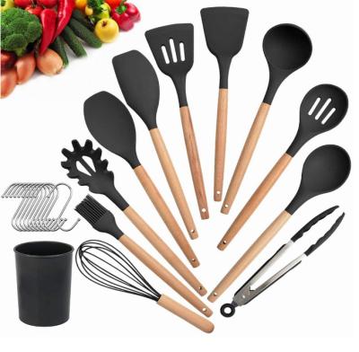 Cina L'utensile nero della cucina del silicone mette ergonomico Hasslefree scratchless in vendita
