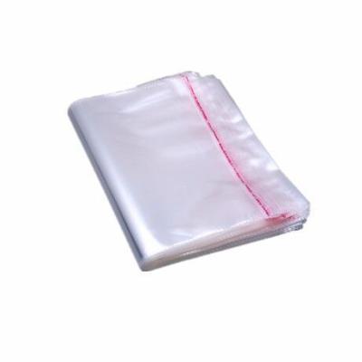 China Width 42cm 100pcs/Pack Extra Large Custom Logo Printing Resealable Apparel Package Self Sealing Bopp Glossy Clear Plastic Bags for sale