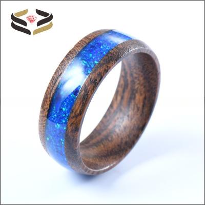 Cina Anelli in legno di ebano dorato con perle, 8mm con intarsio di opale blu in vendita
