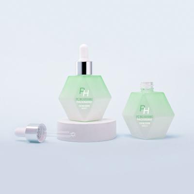 China Customized Unique Shape Frosted Green Glass Serum Dropper Bottles 30ml Essential Oil Bottle for sale