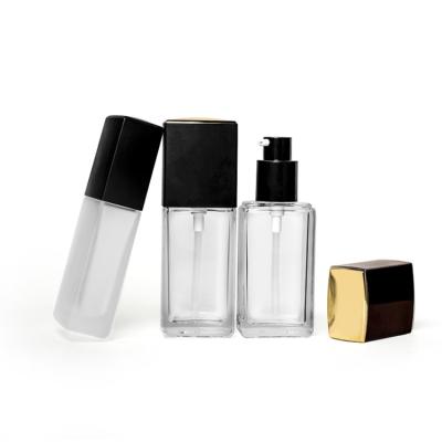 China Square Shaped 30ml Empty Liquid Foundation Glass Bottle With Gold Top Pump for sale