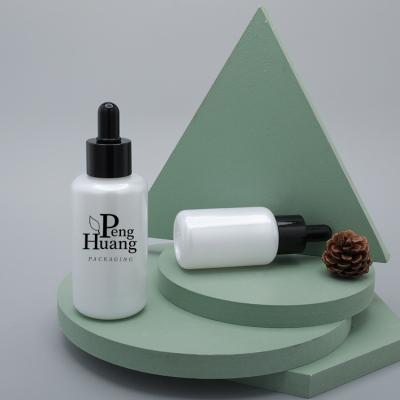 China Glass Boston Round Bottle 30ml 50ml 100ml Silk Screen Printing With Dropper for sale