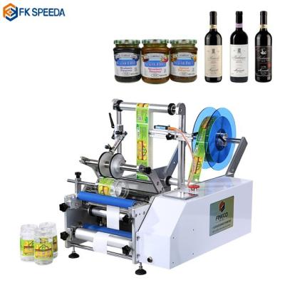 China Máquina de rotulagem semiautomática de 30 bpm para garrafas de cilindro redondo à venda