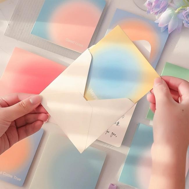 Aesthetic gradient greeting cards and envelopes set showcasing vibrant color transitions